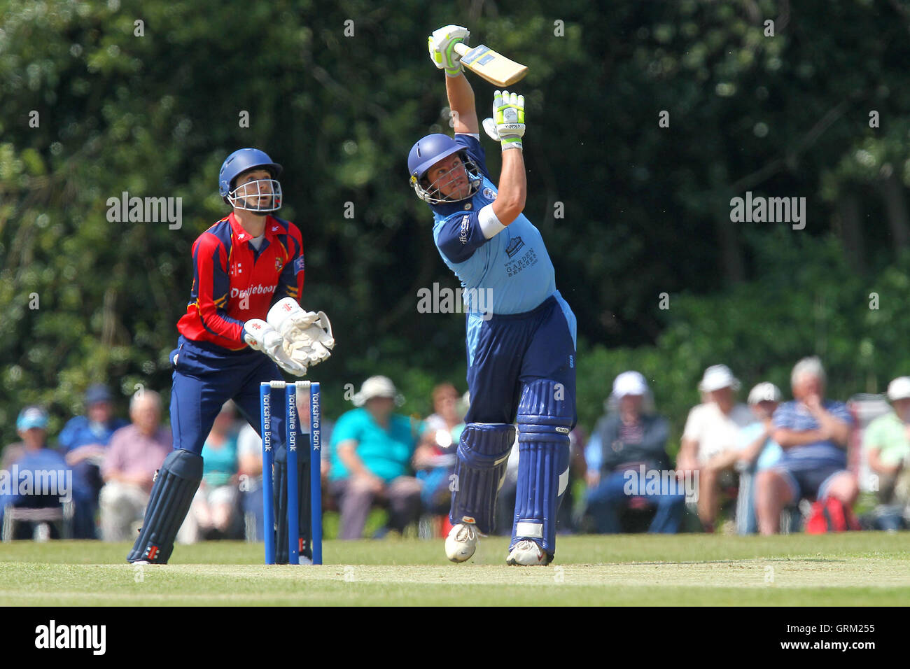 Wes Durston hits six runs for Derbyshire as James Foster looks on ...