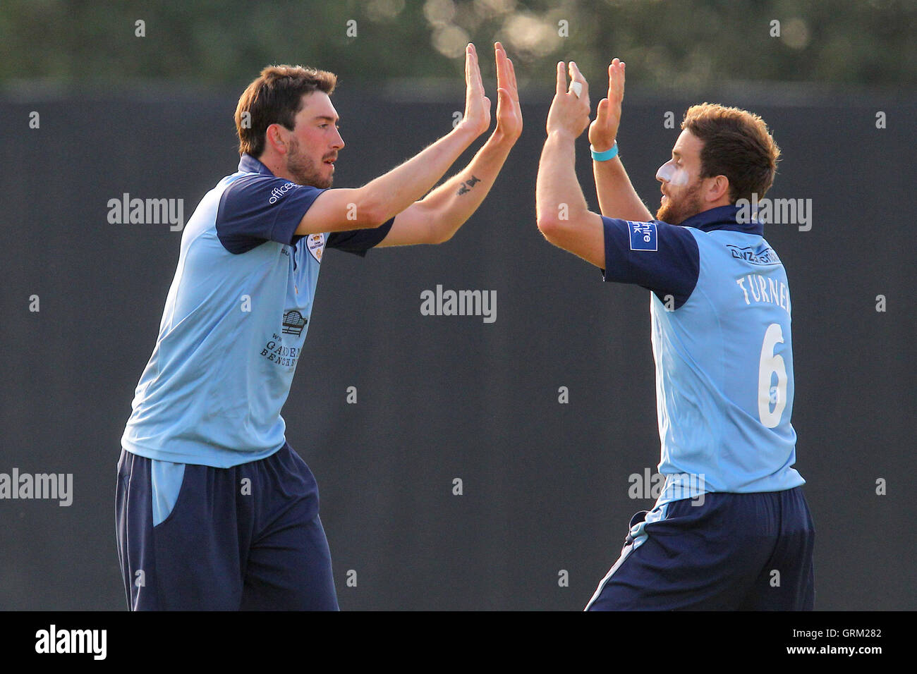 Mark Footitt (L) celebrates the wicket of Graham Napier - Derbyshire ...