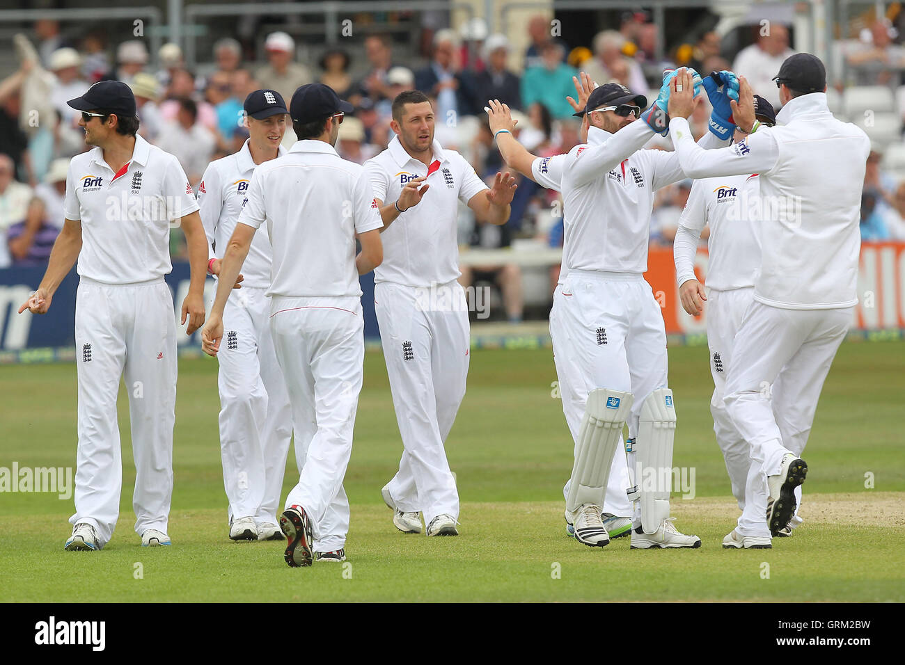 Tim Bresnan (C) of England celebrates the wicket of Hamish Marshall ...
