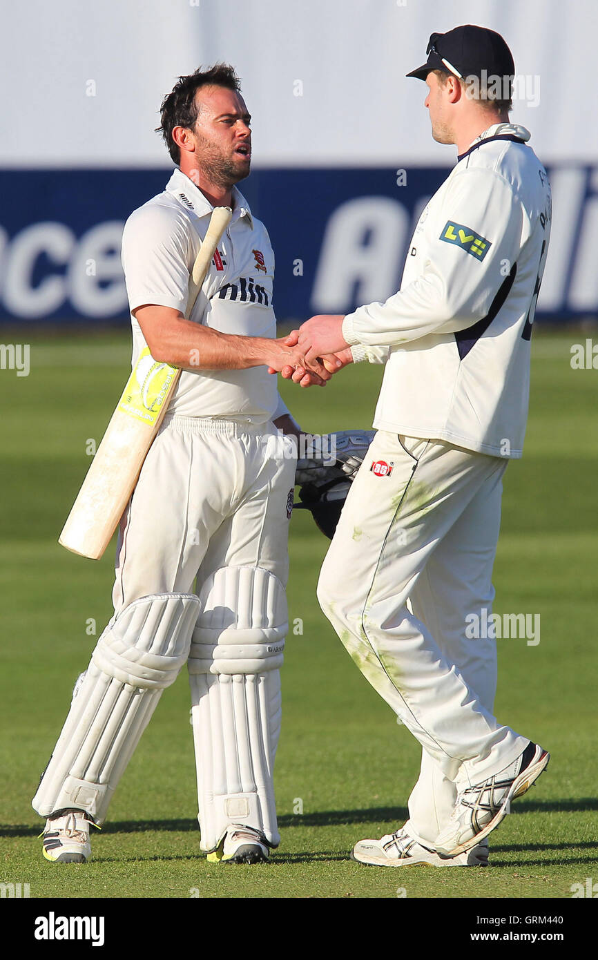David Balcombe of Hampshire (L) congratulates Mark Pettini of Essex at ...