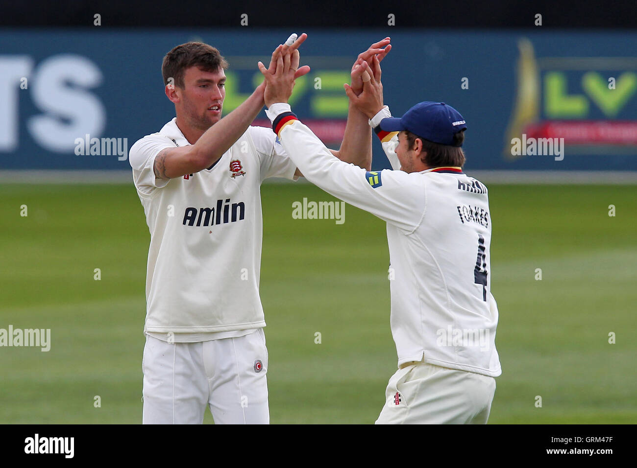 Reece Topley of Esse (L) celebrates the wicket of Adam Wheater - Essex ...