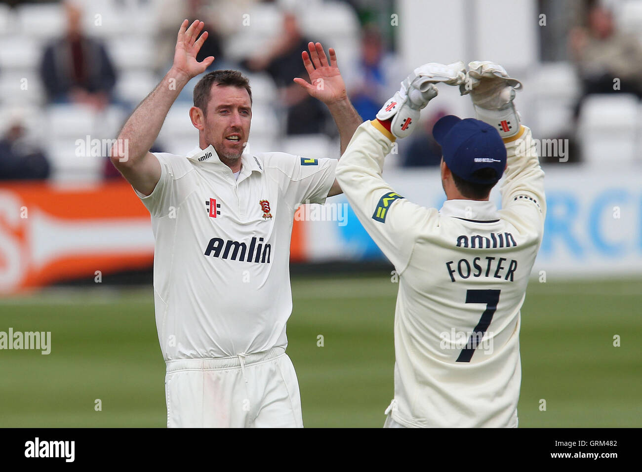 David Masters of Essex (L) celebrates the wicket of David Balcombe with ...