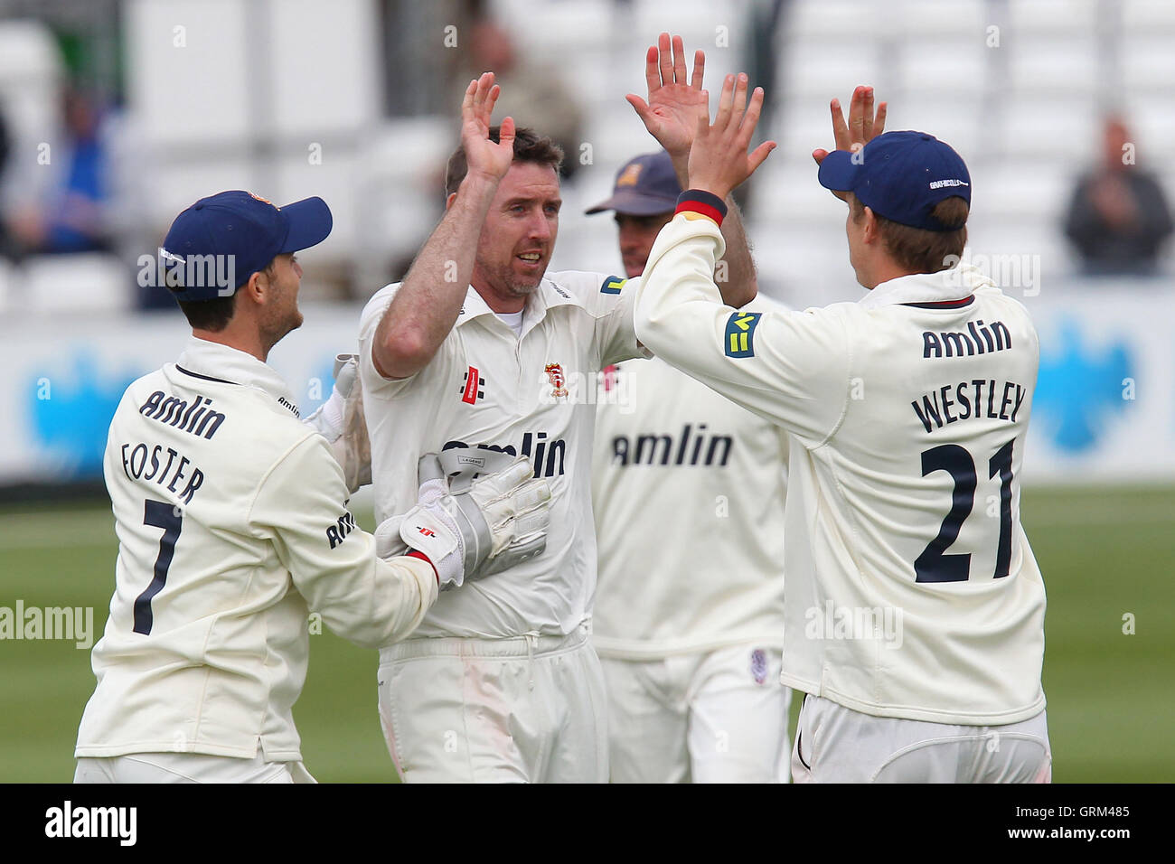 David Masters of Essex (2nd L) celebrates the wicket of David Balcombe ...