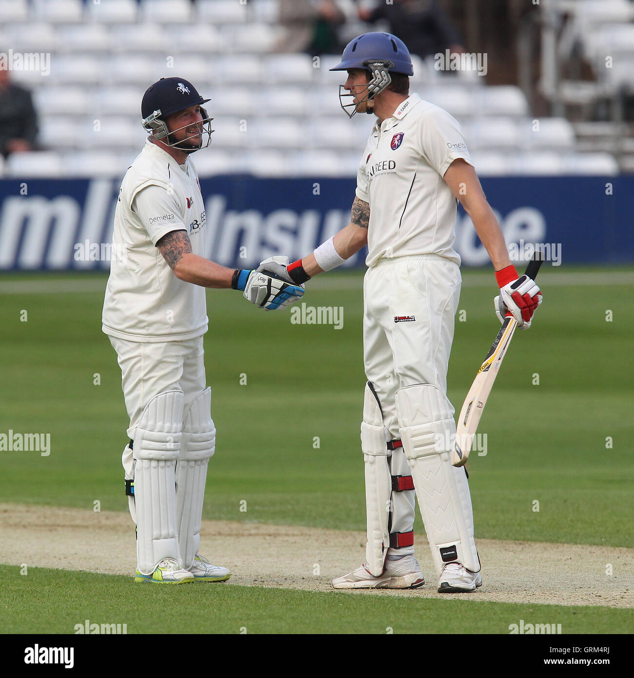 Darren Stevens (L) congratulates Ben Harmison on scoring 50 runs for ...
