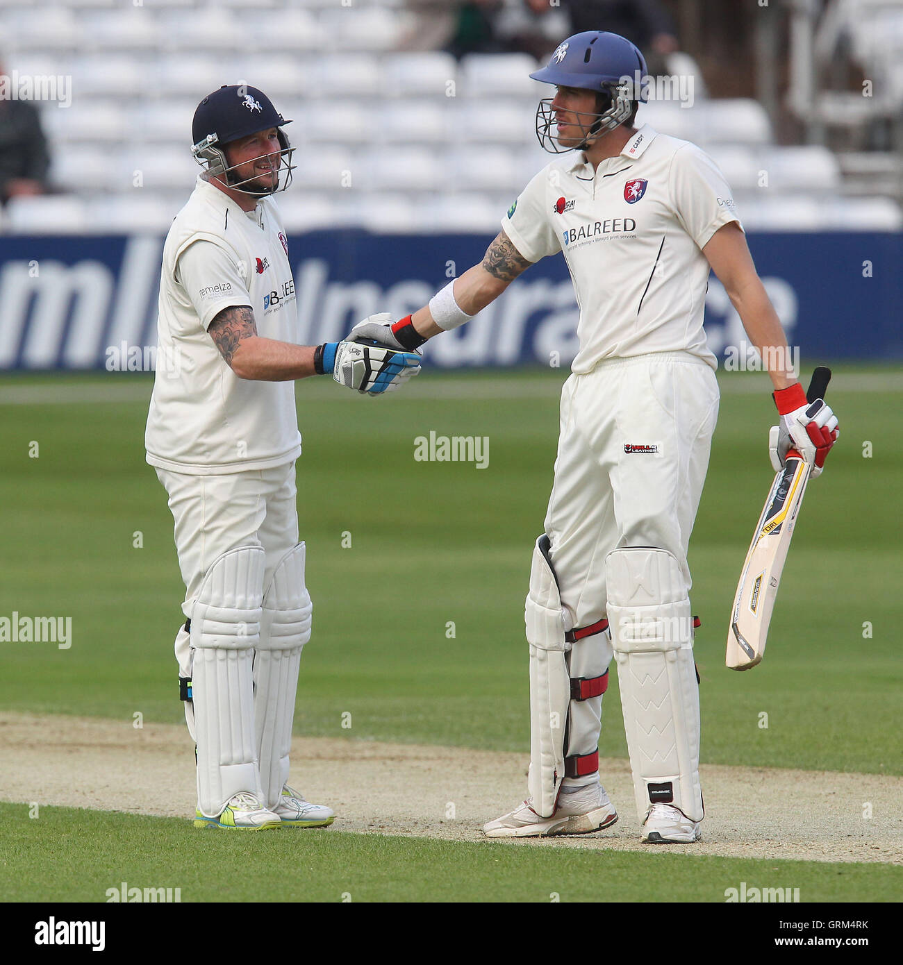 Darren Stevens (L) congratulates Ben Harmison on scoring 50 runs for ...