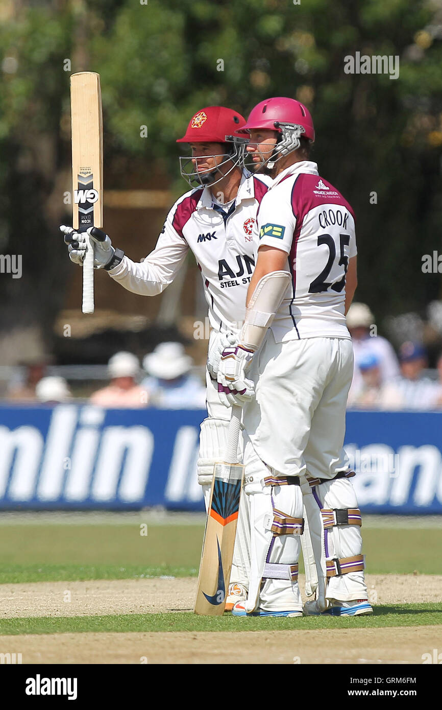 Andrew Hall of Northants celebrates a half-century for his team (L) as ...