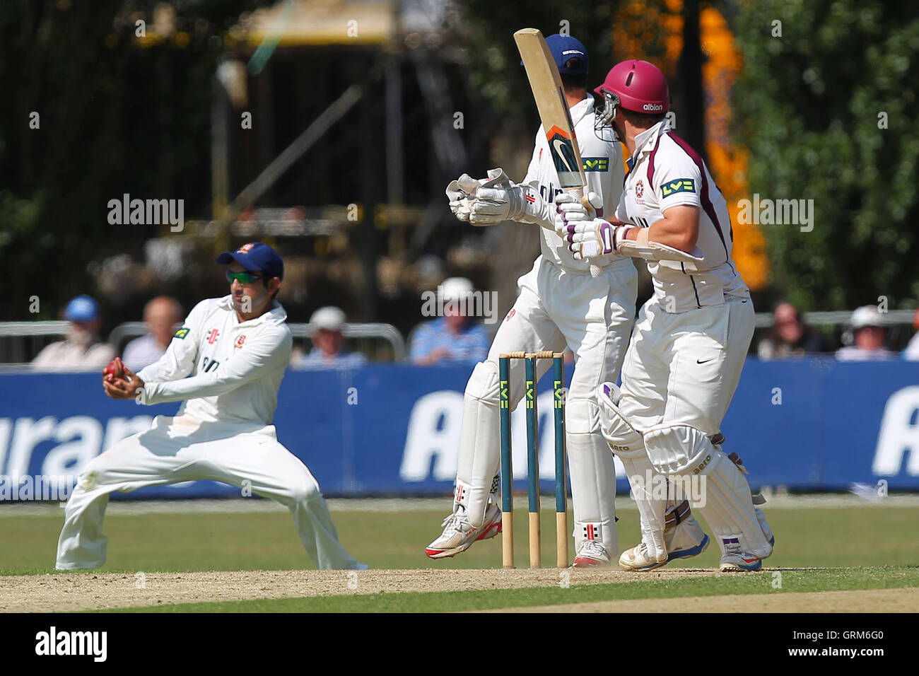 Gautam Gambhir of Essex (L) takes a fine catch to dismiss Steven Crook ...