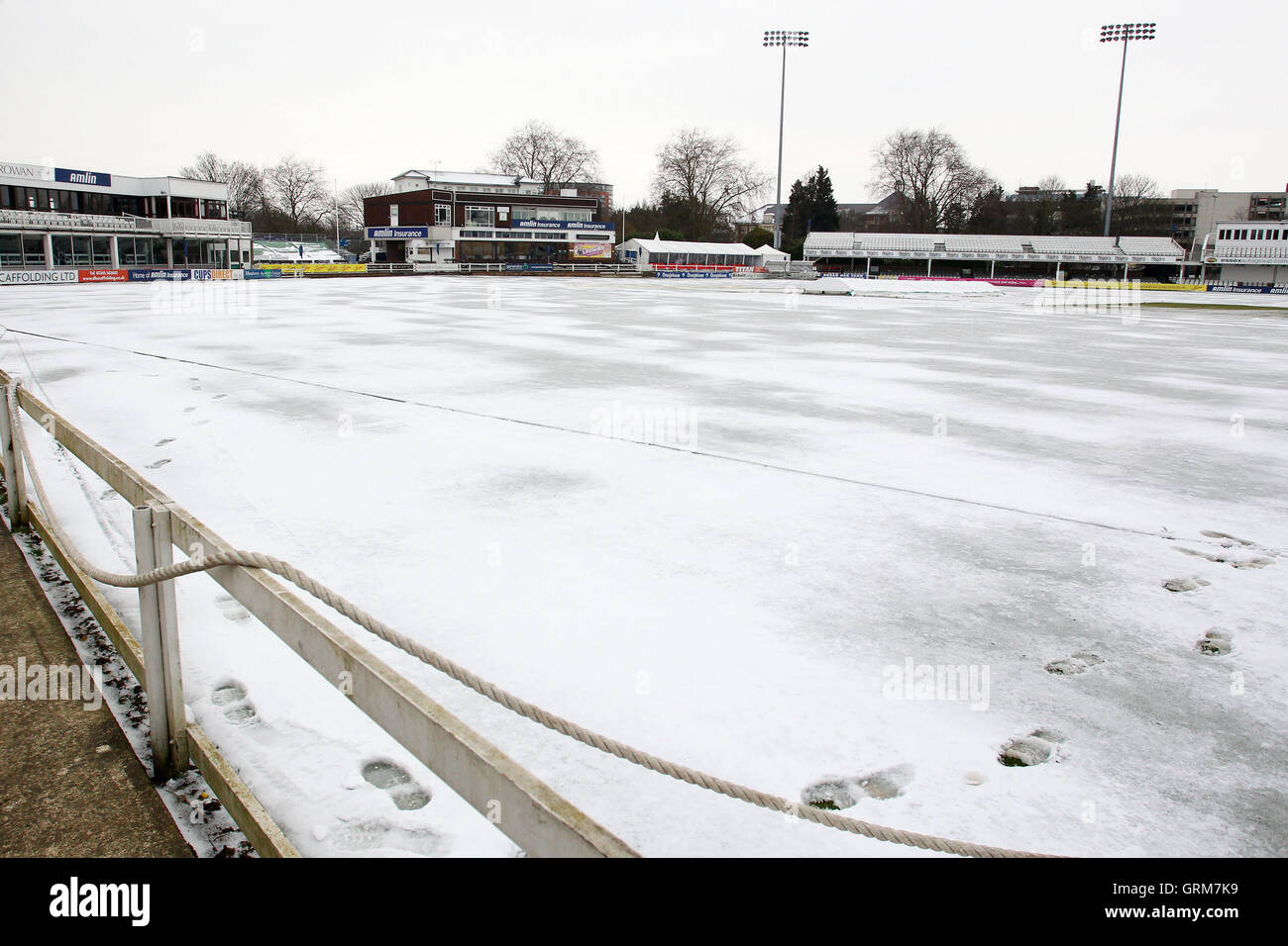Snow covers the outfield at the Essex County Ground in Chelmsford ...
