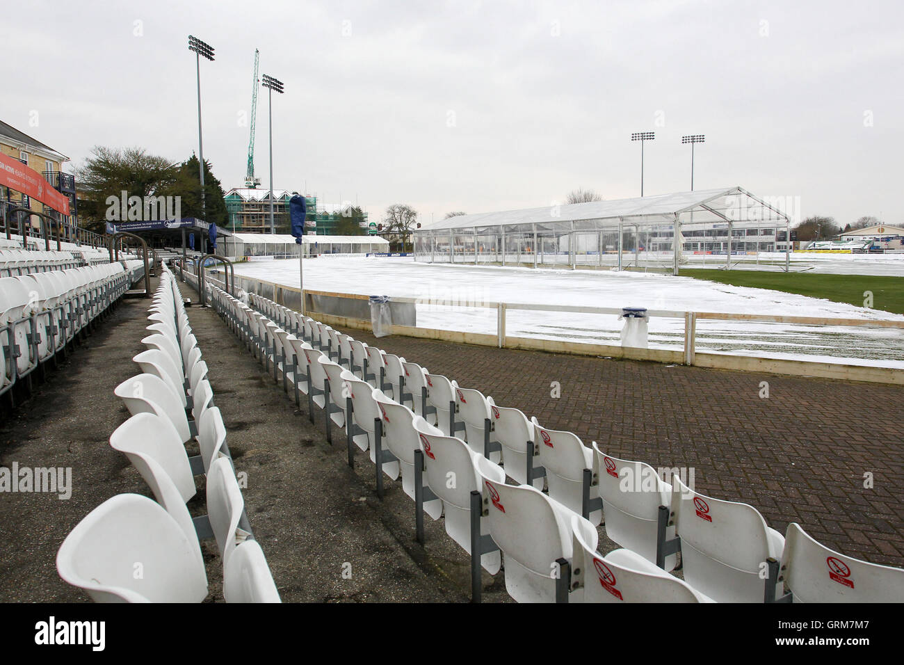 Snow covers the outfield at the Essex County Ground in Chelmsford ...