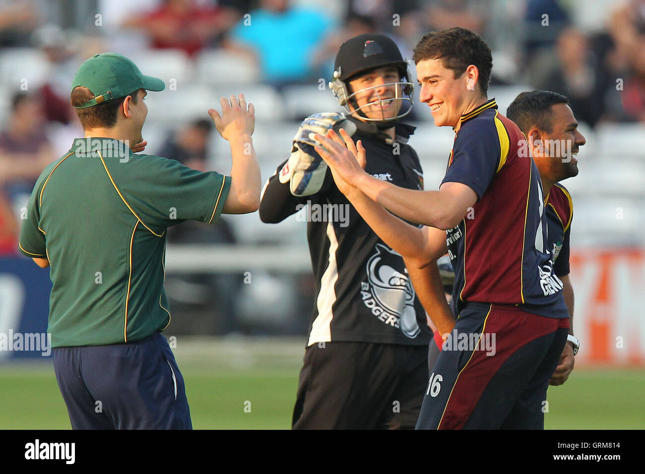 Joe Ellis-Grewal (R) celebrates the wicket of Essex batsman Graham ...