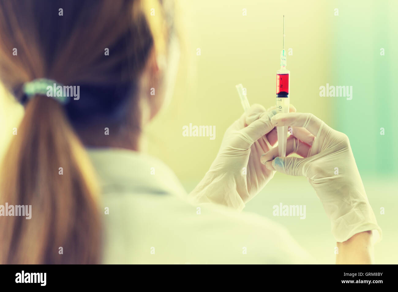 Hand doctor syringe in hi-res stock photography and images - Alamy