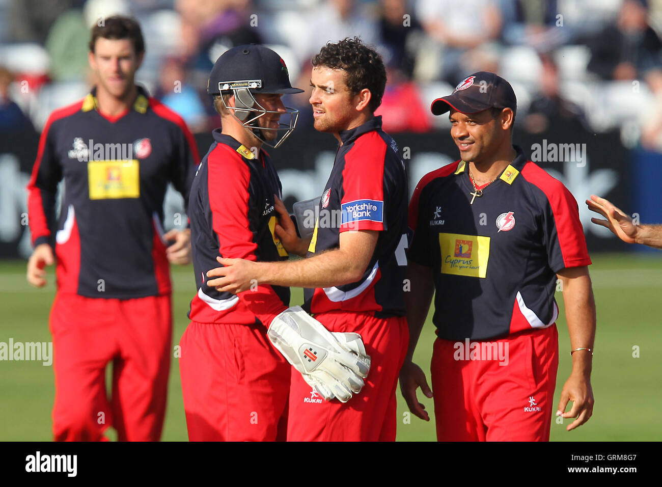 Stephen Parry (C) of Lancashire celebrates the wicket of Ryan ten ...