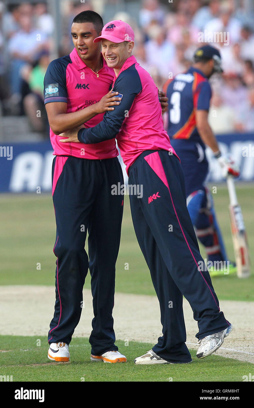 Gurjit Sandhu of Middlesex (L) celebrates the wicket of Jaik ...