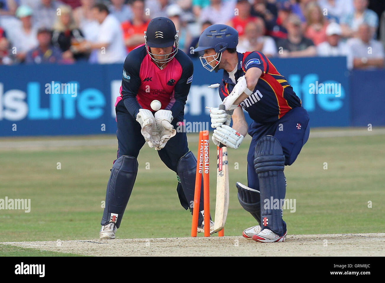 James Foster of Essex is bowled out by Neil Dexter as Adam Rossington ...