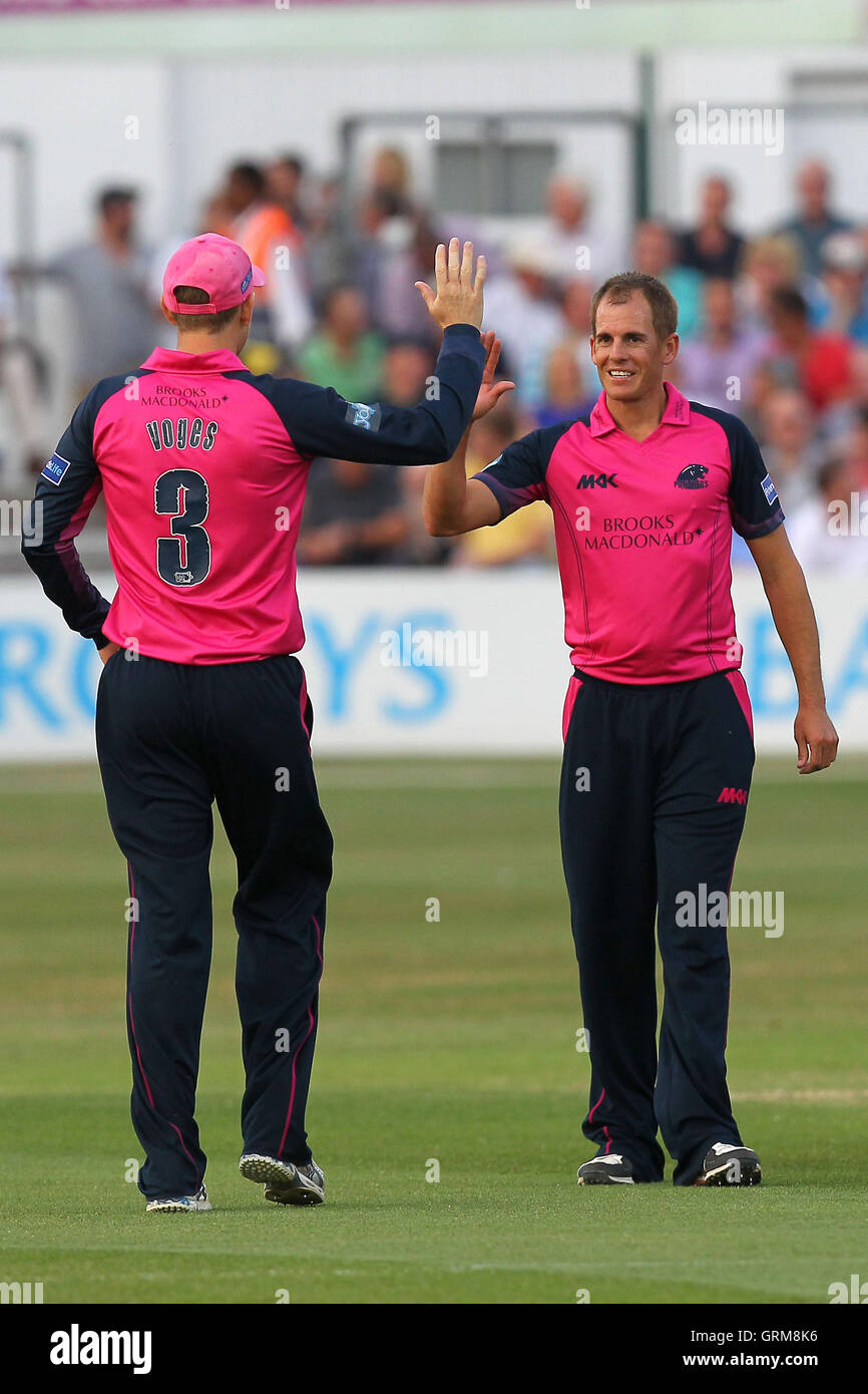 Neil Dexter of Middlesex (R) celebrates the wicket of Tim Phillips ...