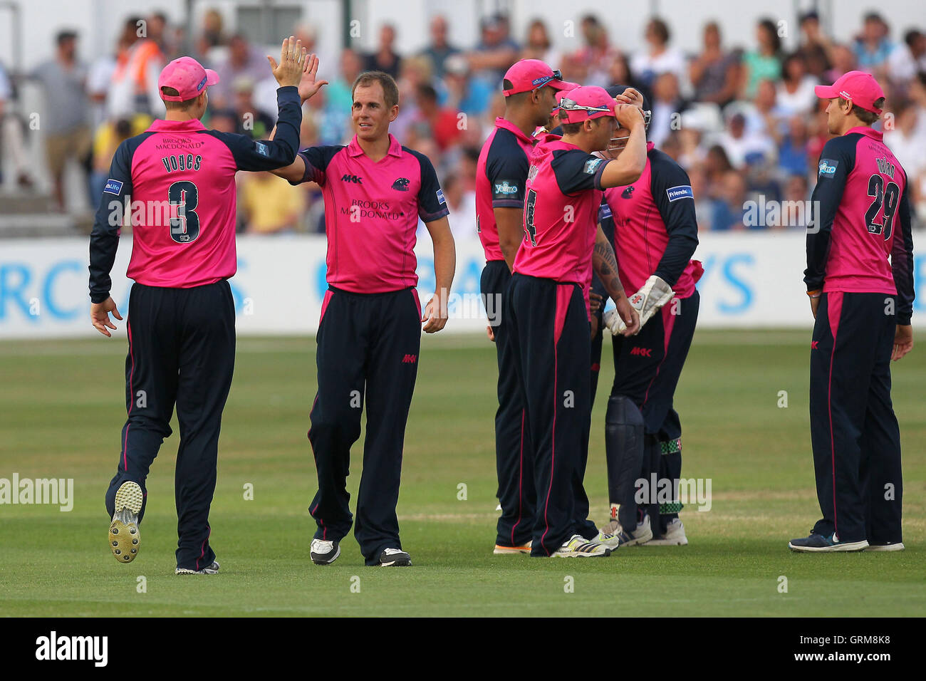 Neil Dexter of Middlesex (2nd L) celebrates the wicket of Tim Phillips ...