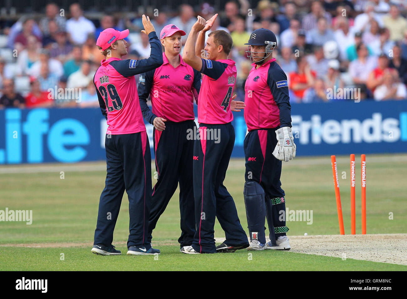 James Foster of Essex is bowled out by Neil Dexter who celebrates with ...