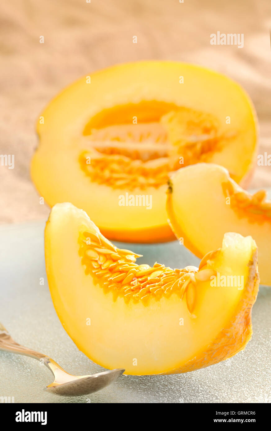Yellow melon slices Stock Photo - Alamy