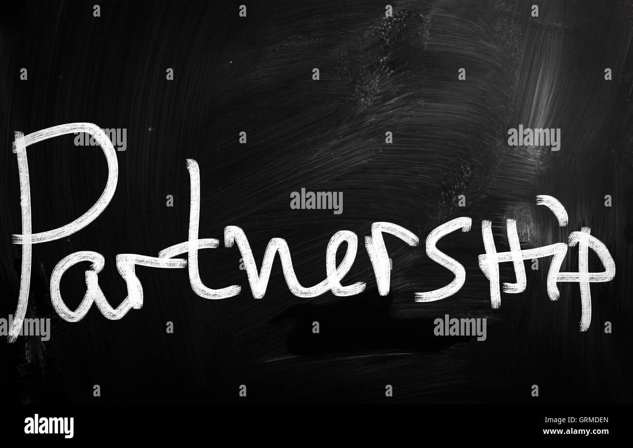 'Partnership' handwritten with white chalk on a blackboard Stock Photo ...