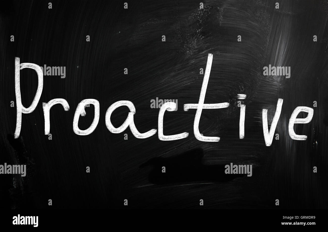 The word 'Proactive' handwritten with white chalk on a blackboar Stock ...