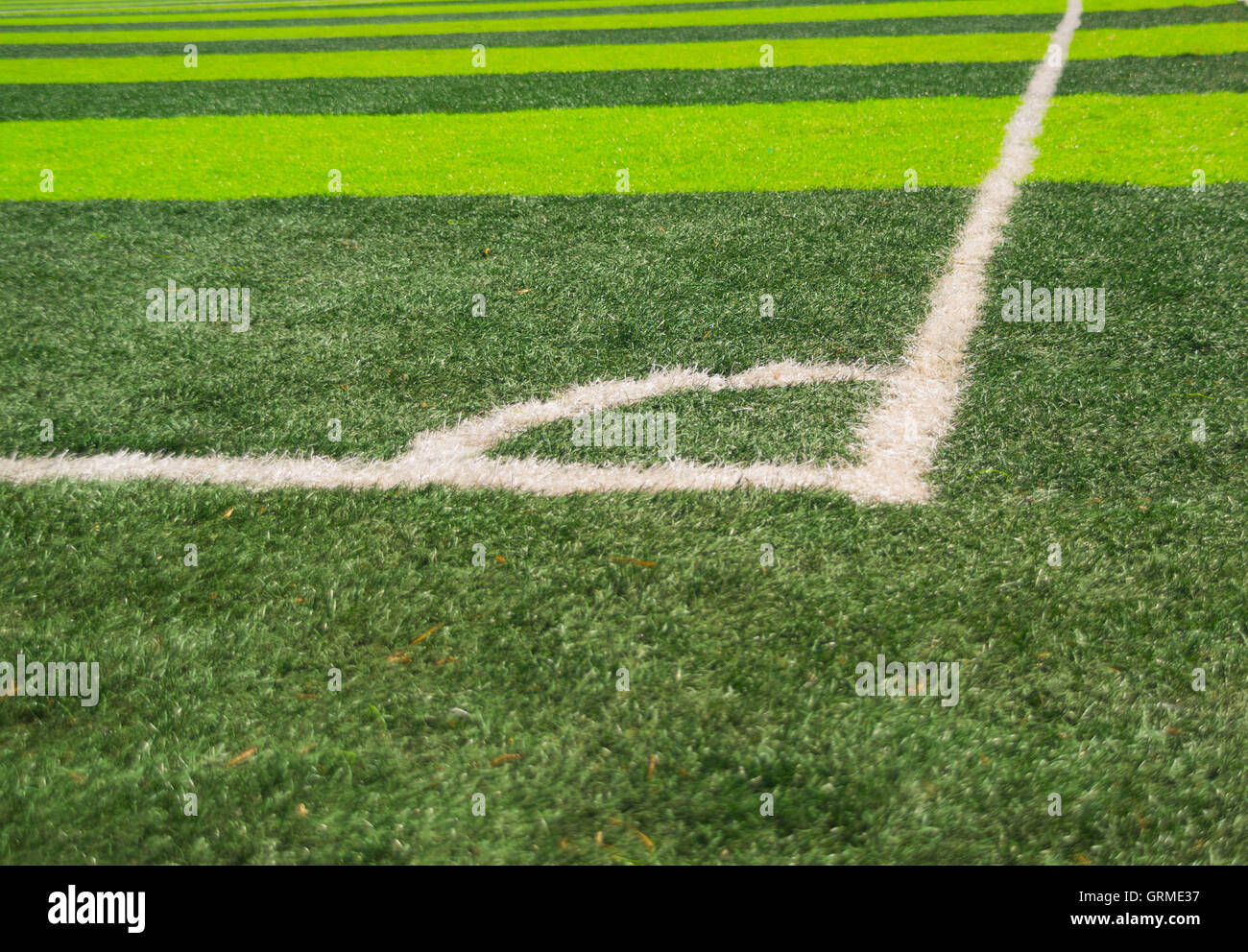 Closeup corner of artificial green grass football surface, beautiful ...