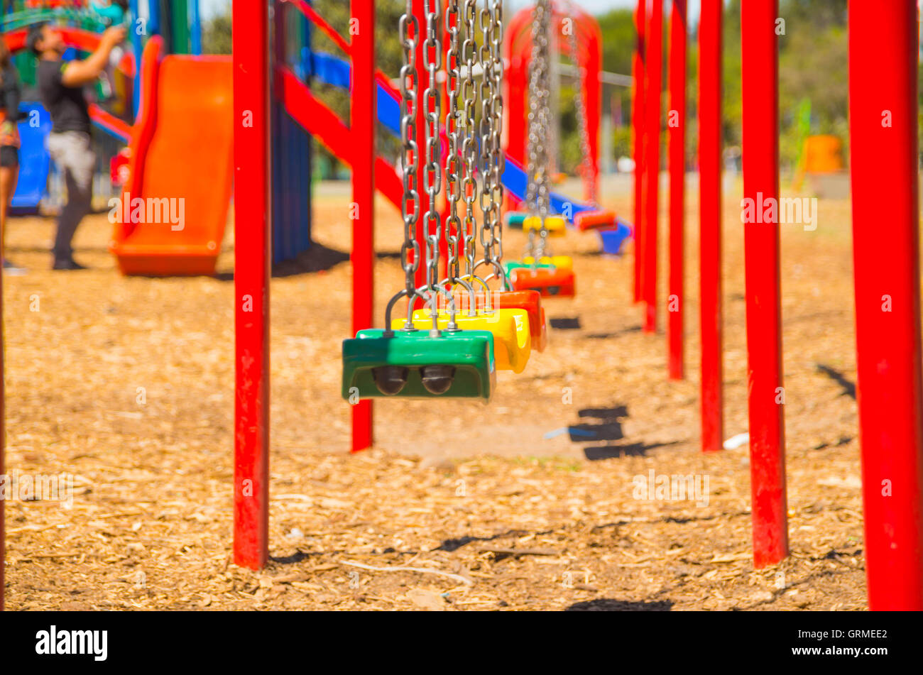 QUITO, ECUADOR - 8 AUGUST, 2016: Colorful public playground swings ...