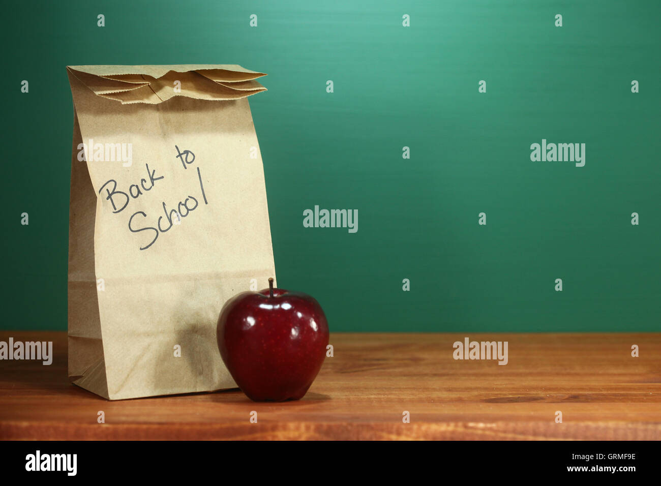 School Lunch Sack Sitting on Teacher Desk Stock Photo - Alamy