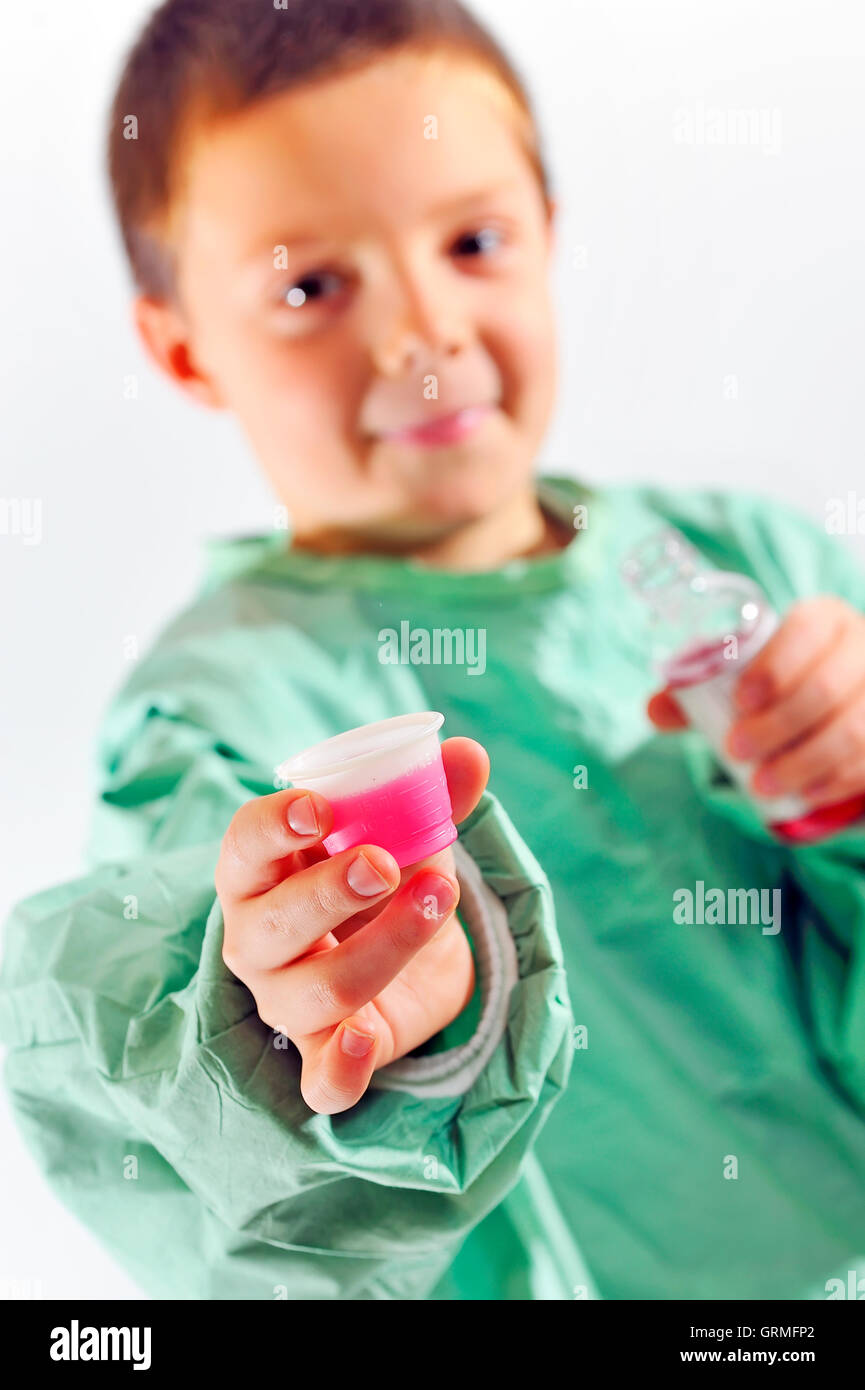 little doctor boy giving syrup Stock Photo - Alamy