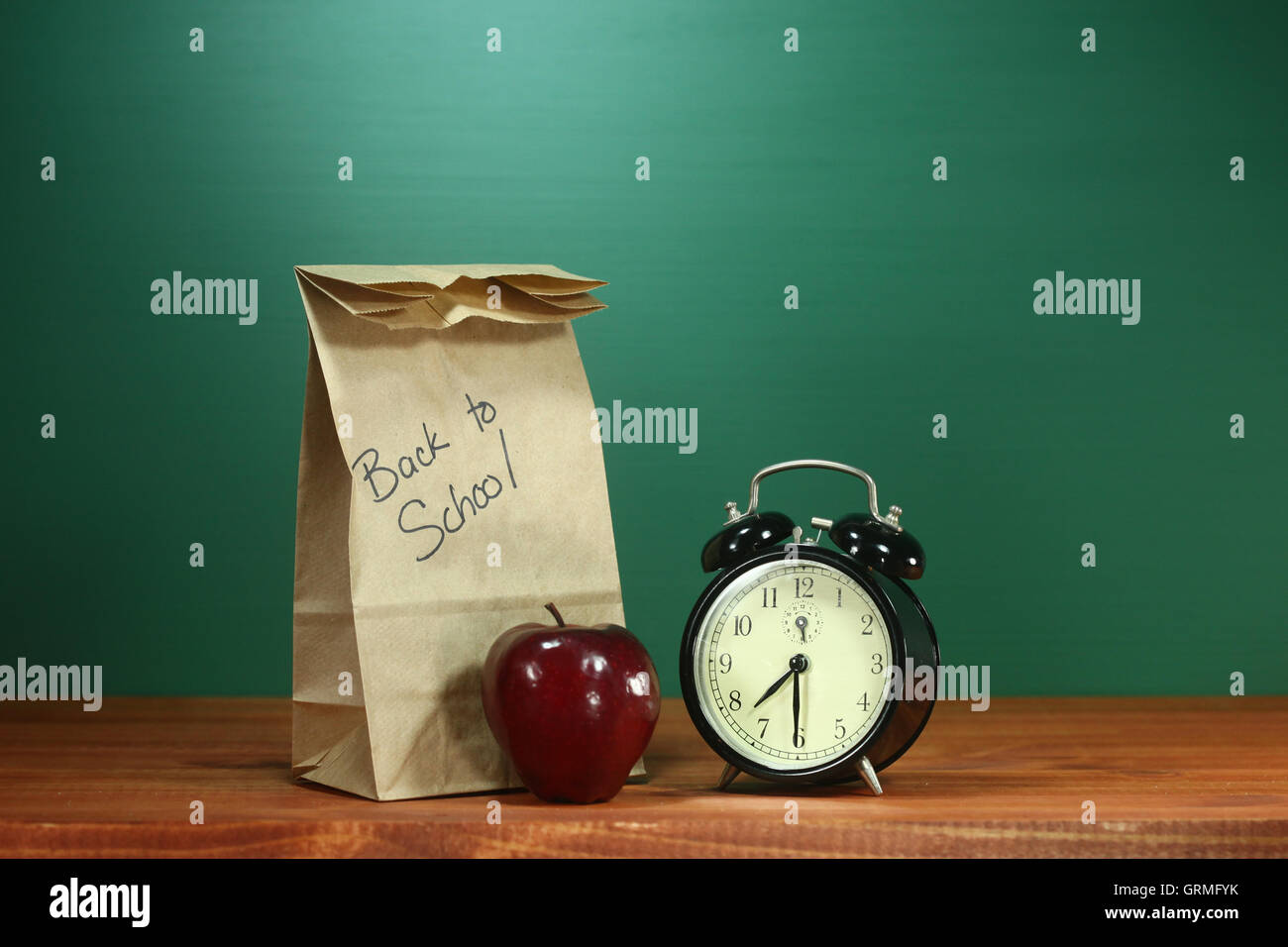 School Lunch, Apple and Clock on Desk at School Stock Photo - Alamy