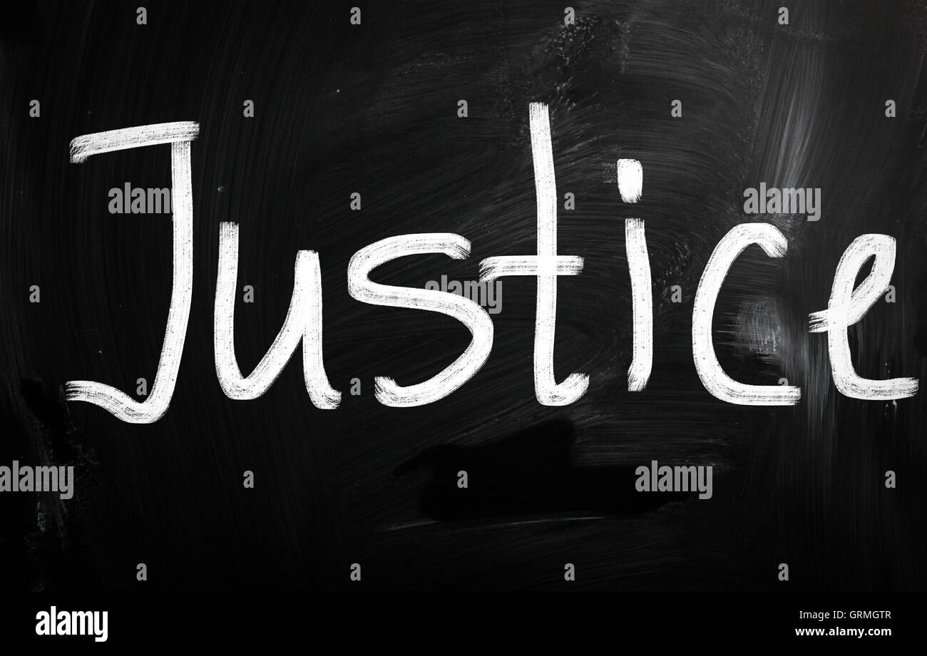 The word "Justice" handwritten with white chalk on a blackboard Stock ...