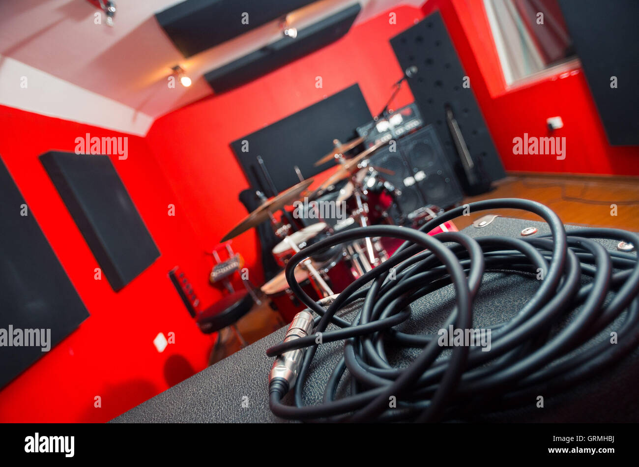 Closeup standard black audio cables rolled into bundle, studio main ...