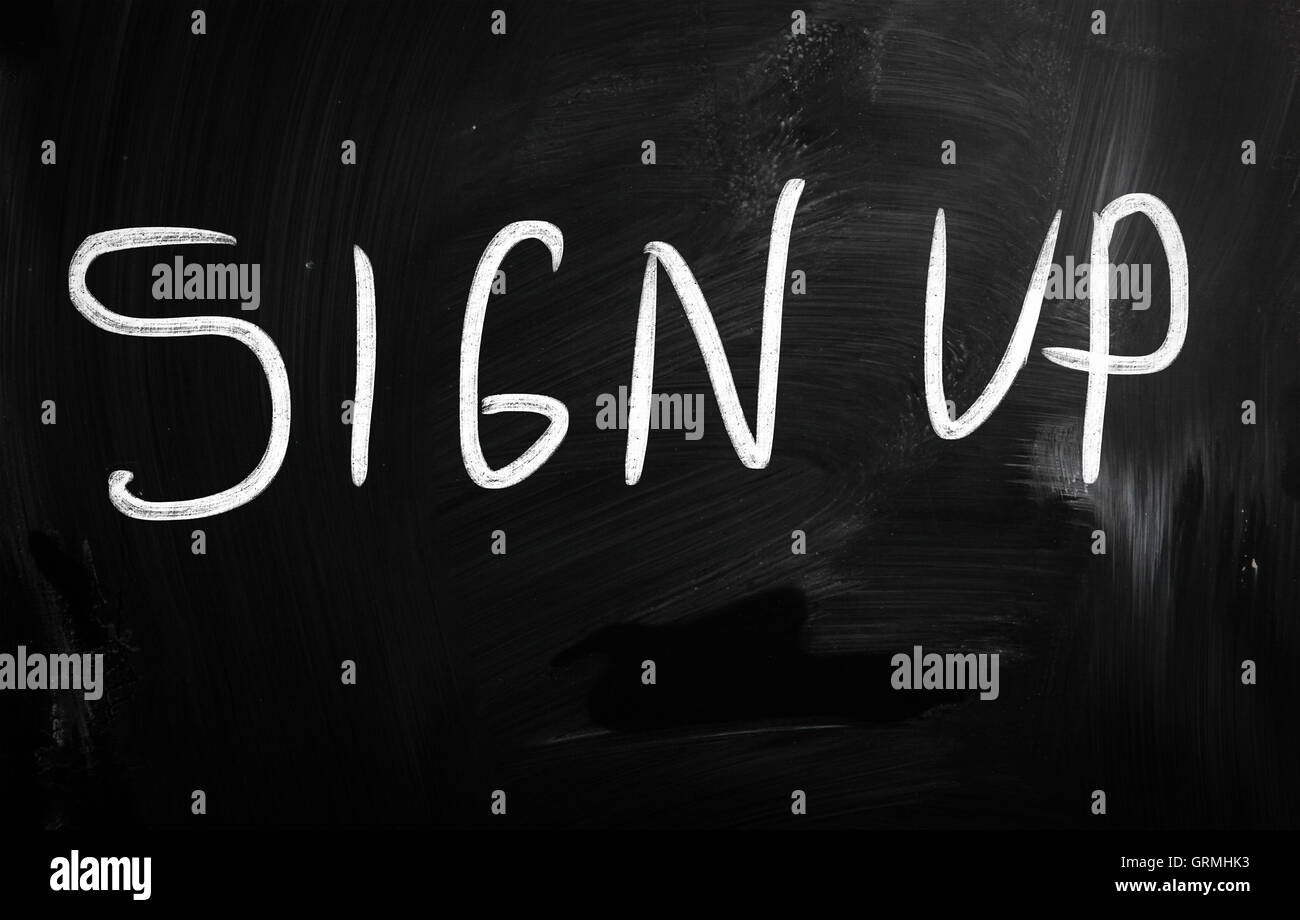 Sign up handwritten with white chalk on a blackboard Stock Photo - Alamy