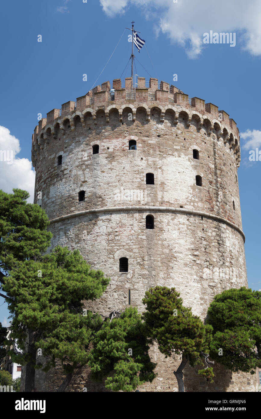 Thessaloniki, Greece. The White Tower with Greek flag waving on top ...
