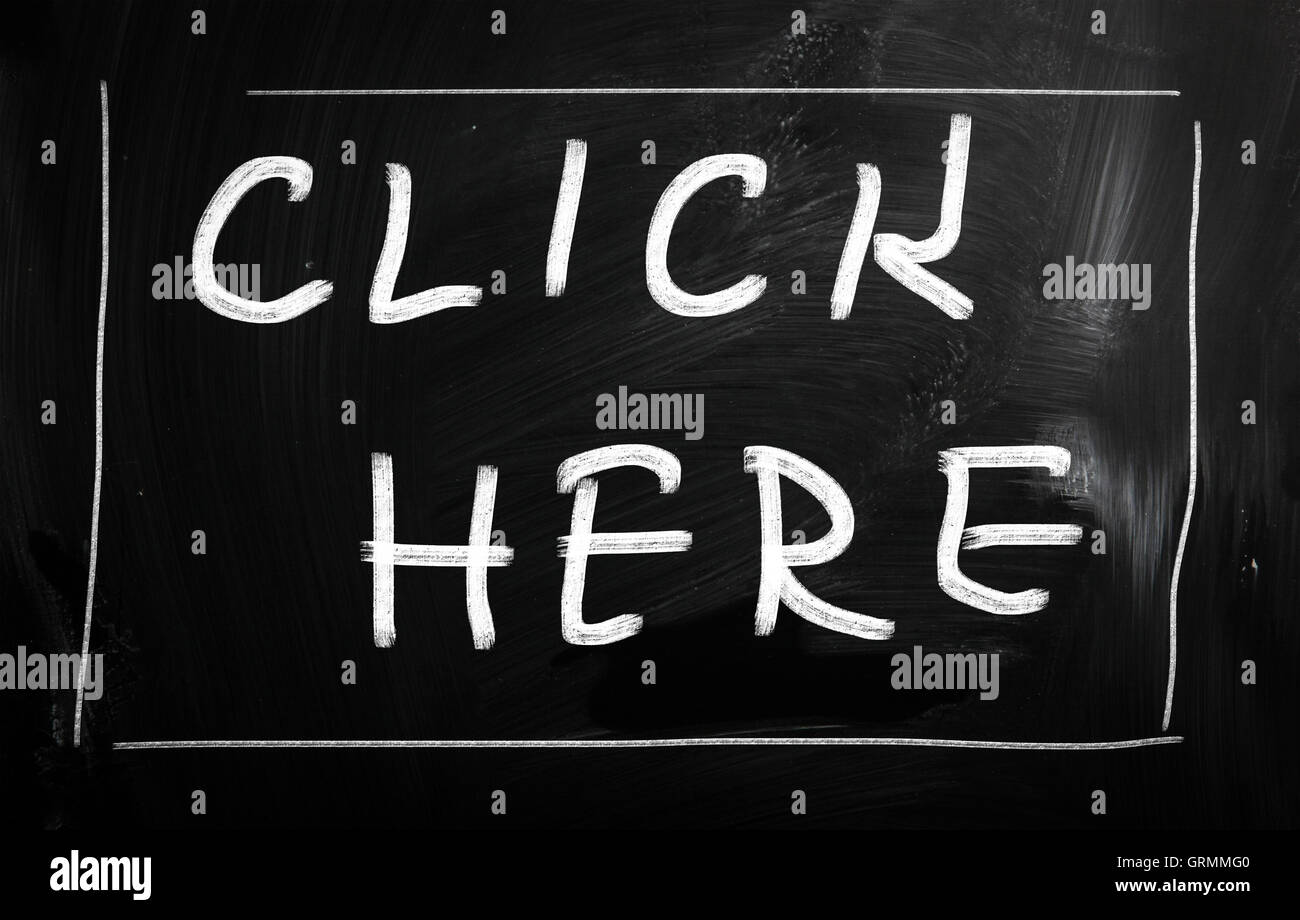 Click here handwritten with white chalk on a blackboard Stock Photo - Alamy