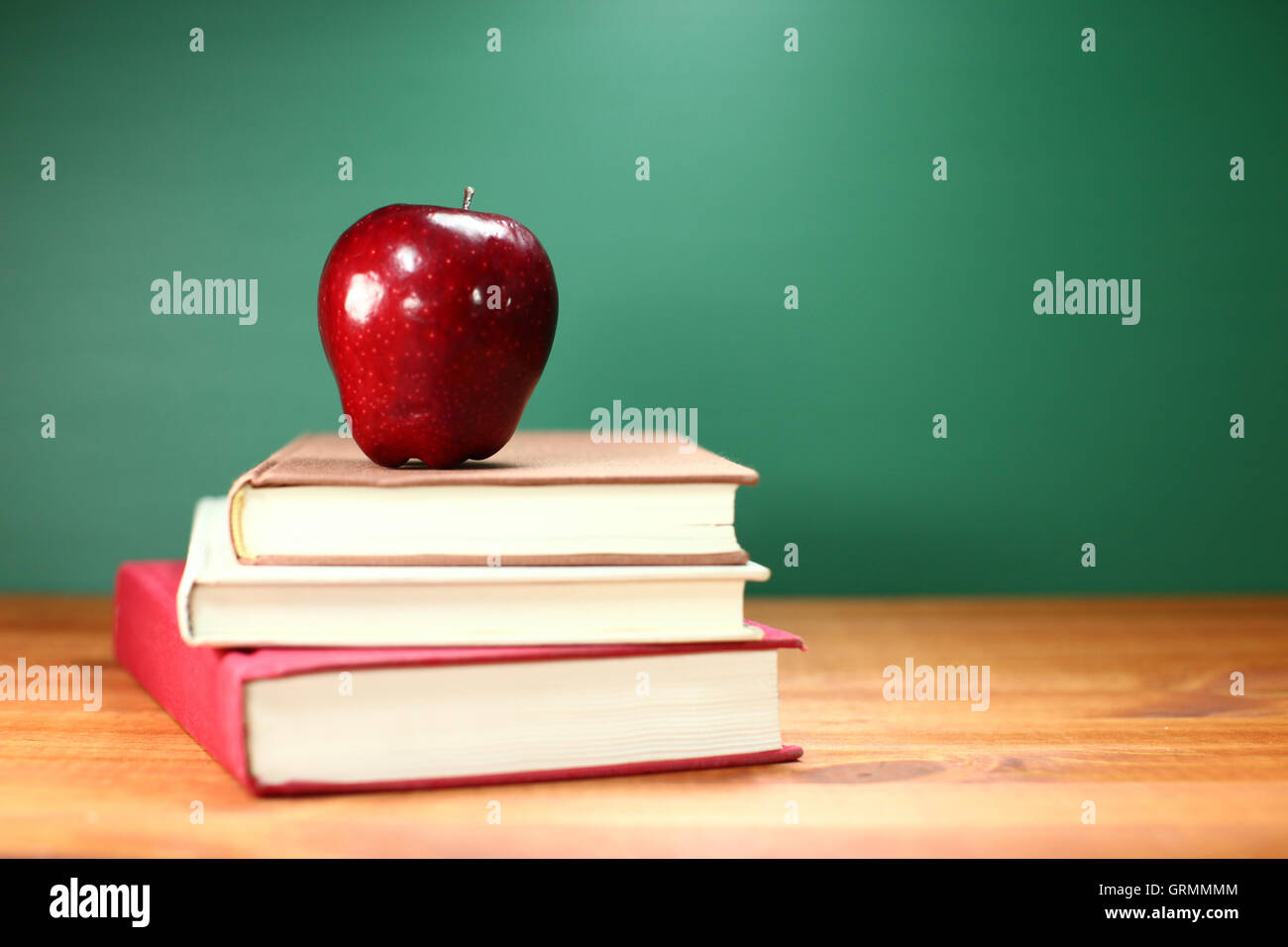 Back to School Books and Apple With Chalkboard Stock Photo - Alamy