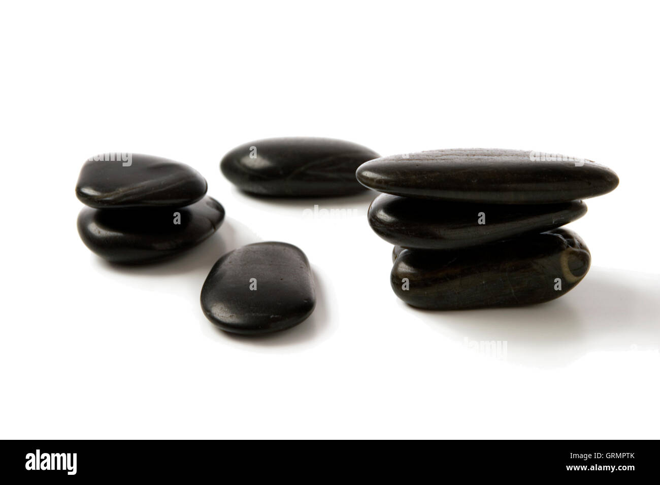 black pebble stone over white background Stock Photo - Alamy