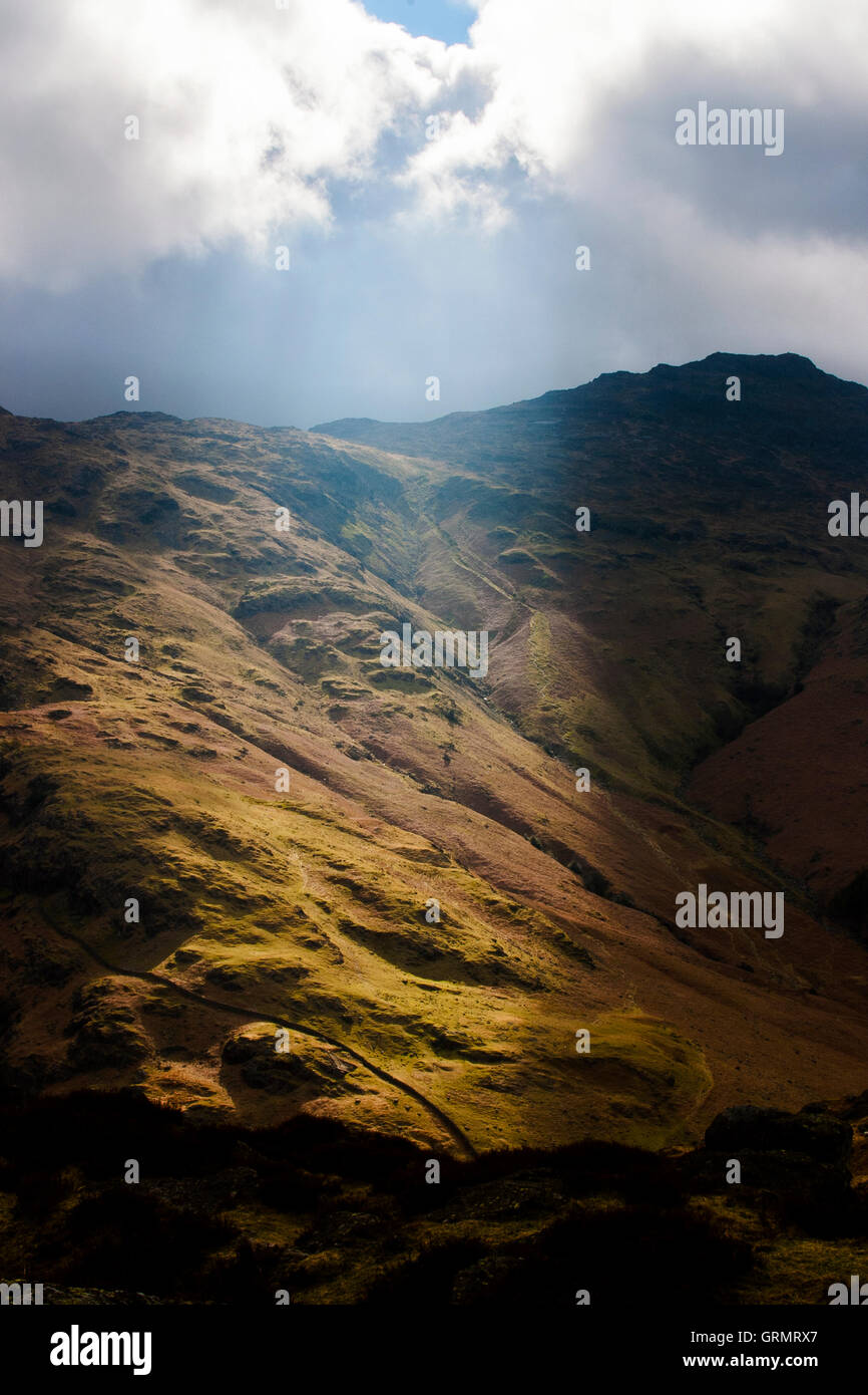 Sun shard lighting dark mountains hi-res stock photography and images ...