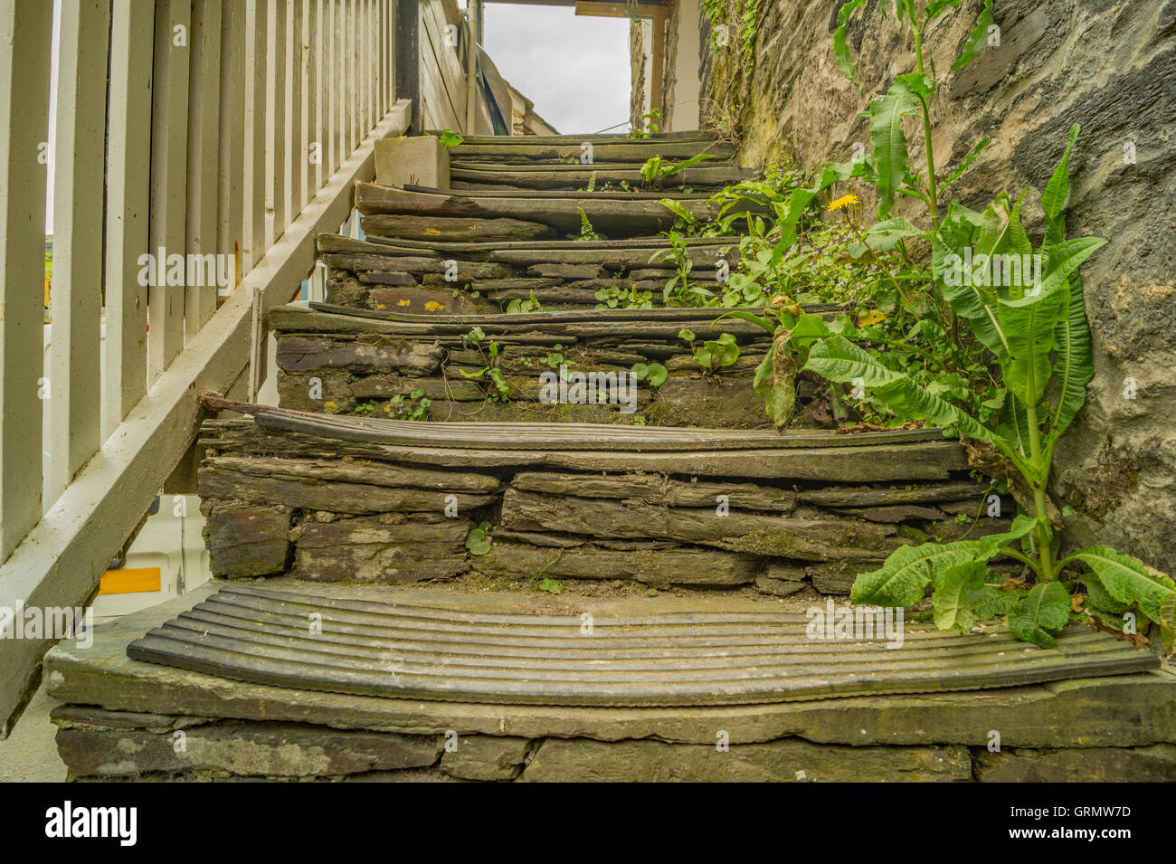 Worn slate steps leading up to a rural village house Stock Photo - Alamy