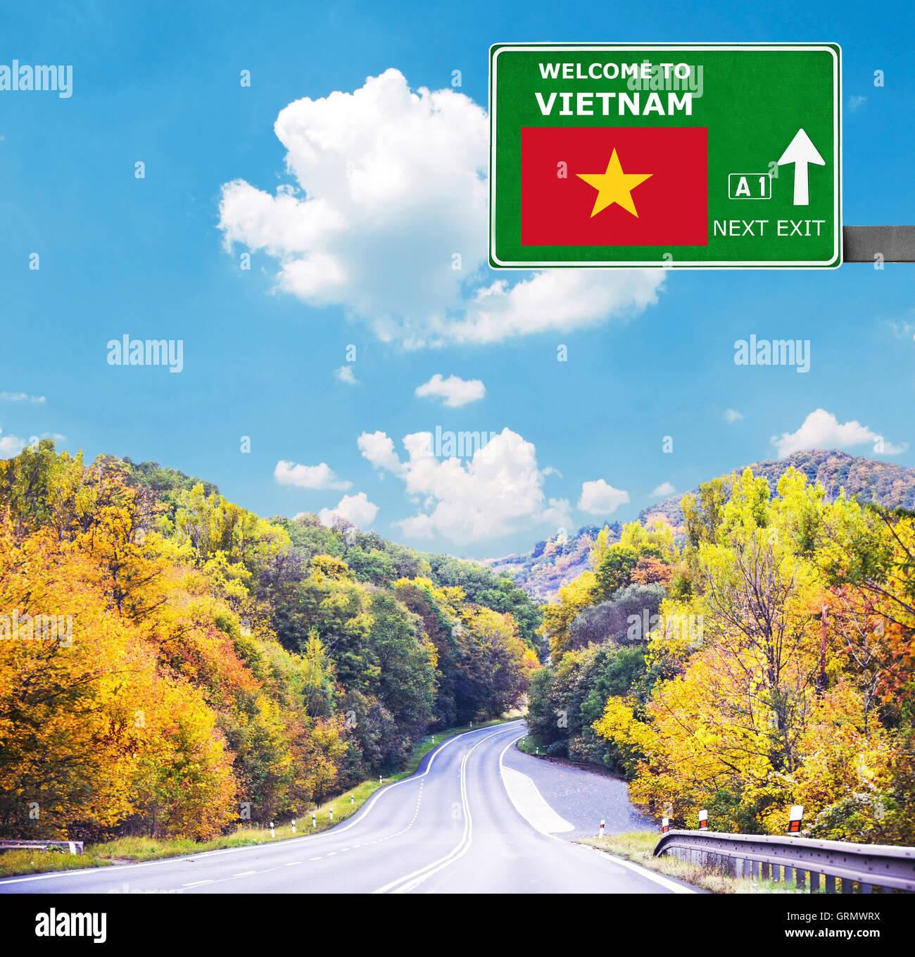 Vietnam road sign against clear blue sky Stock Photo - Alamy