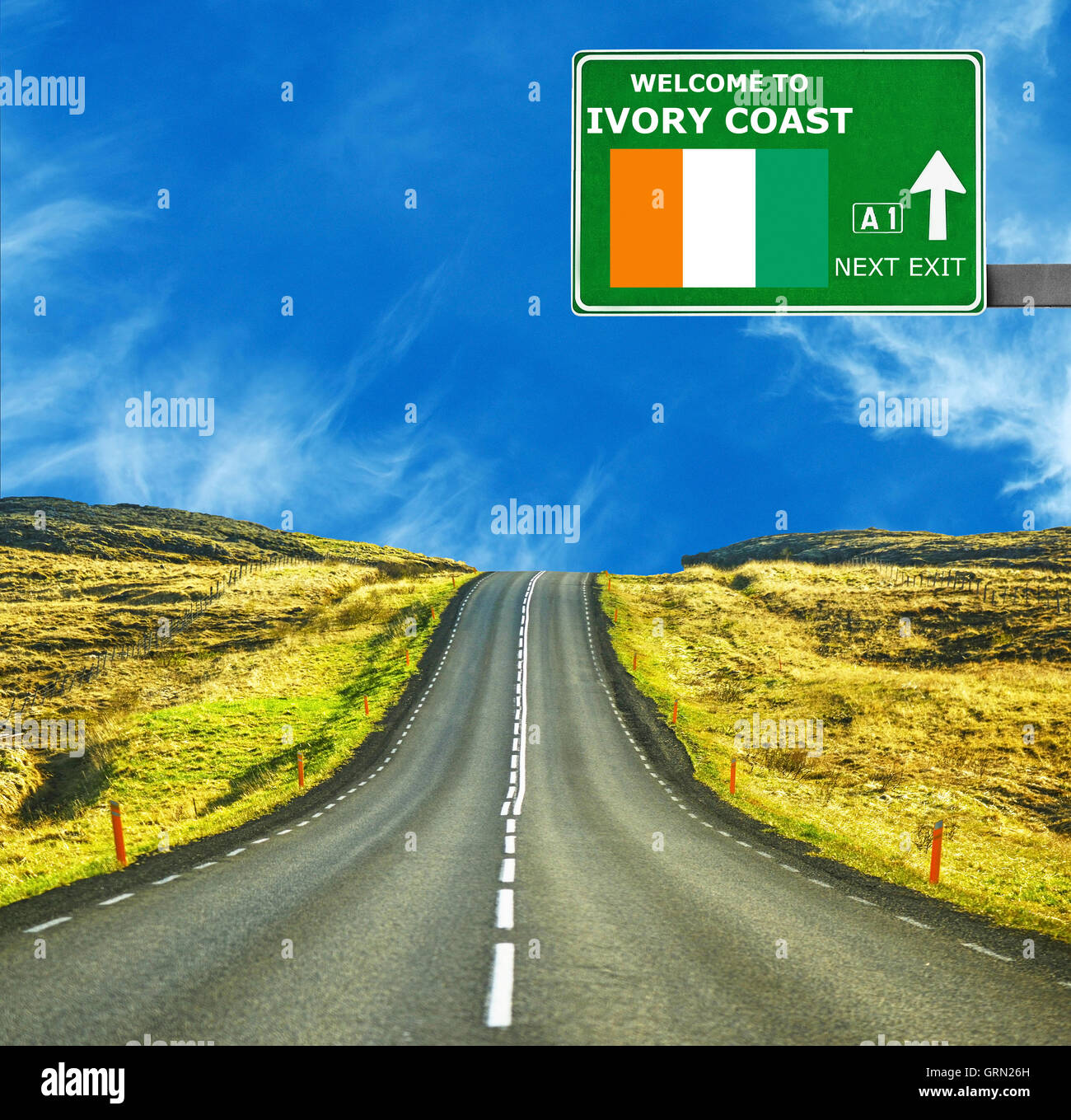 Ivory Coast road sign against clear blue sky Stock Photo - Alamy