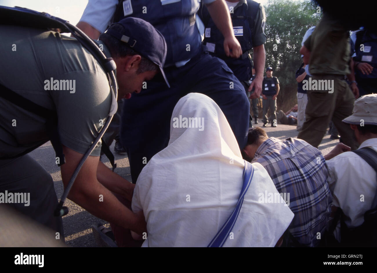 Gaza Disengagement, 2005. Policemen clear a road from protesters ...