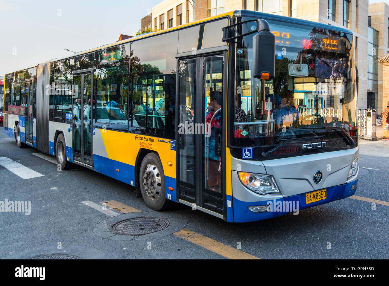 Articulated public service buses are a common sight on Beijing streets ...