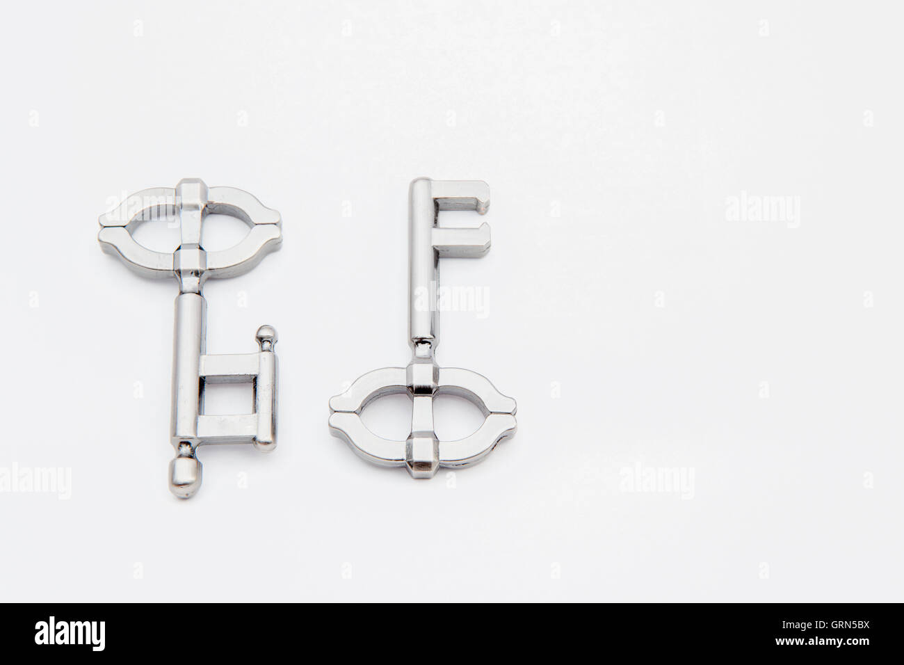 These are metal puzzle keys that can halls together and apart Stock ...