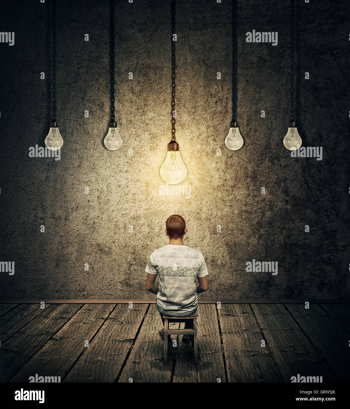 Creative idea concept with a person sitting in a dark room with ...