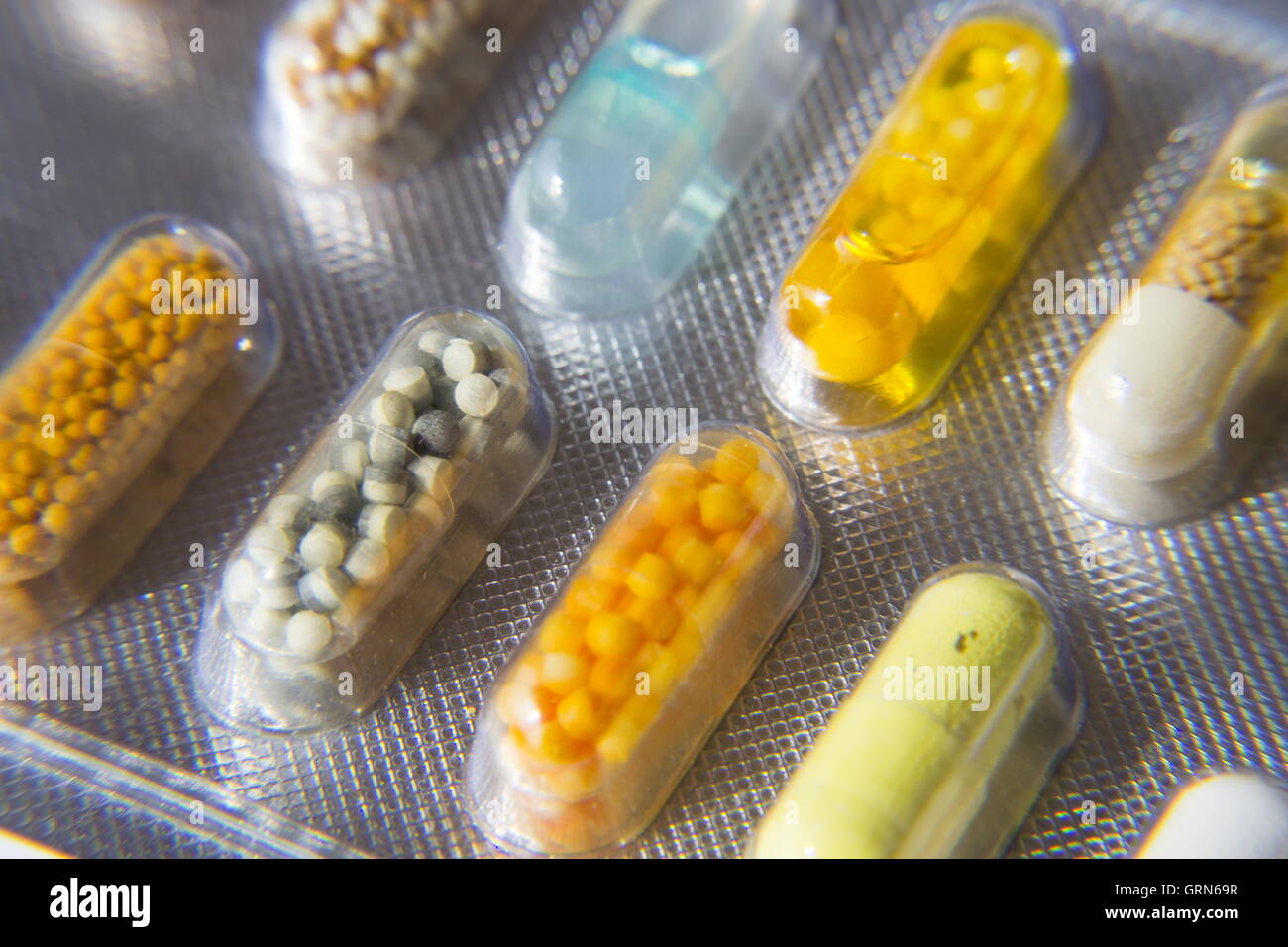Detail of various colorful pills in transparent medicine capsule Stock ...