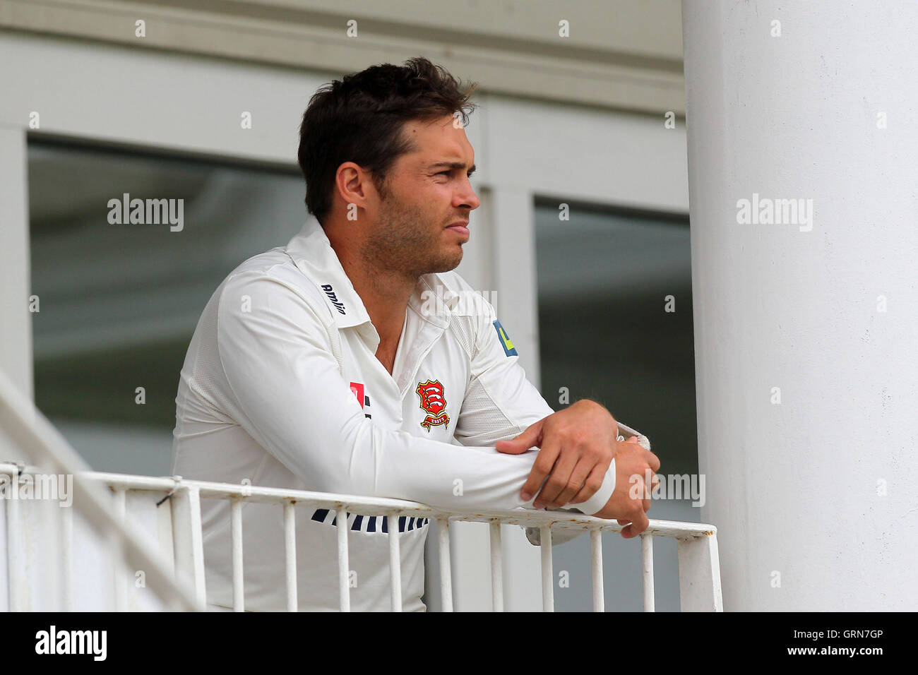 Greg Smith of Essex looks on from the dressing room balcony ...