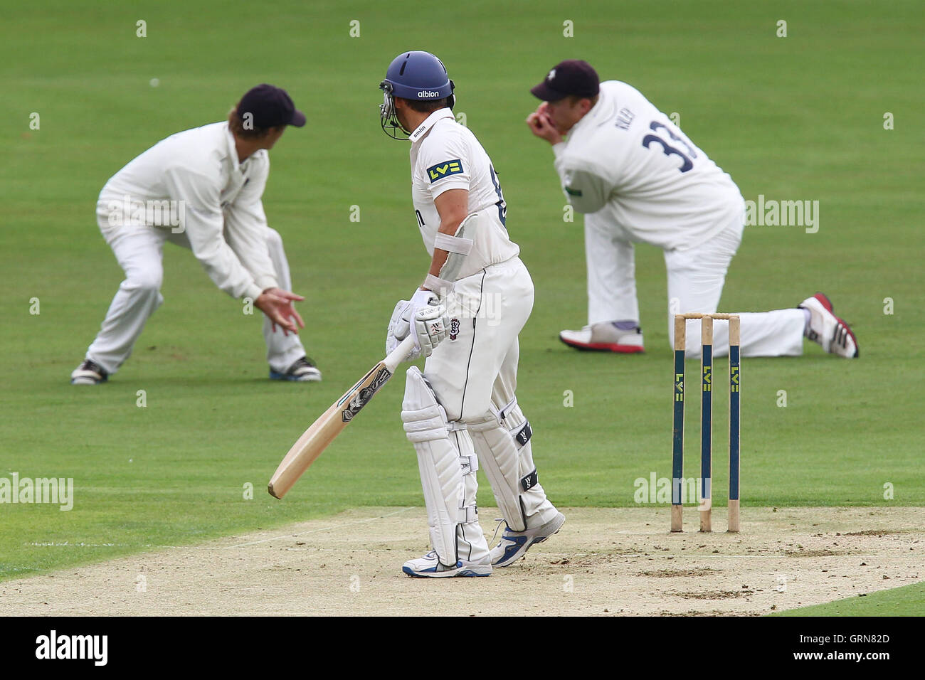 Greg Smith of Essex looks back as he is caught behind by Adam Riley (R ...