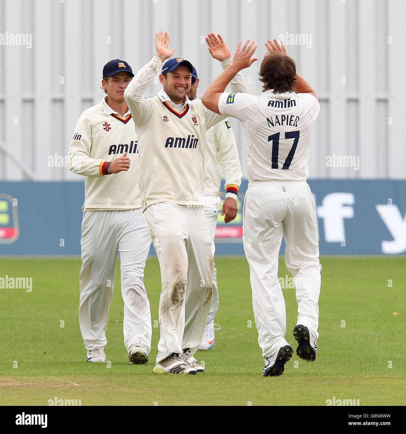 Nick Browne of Essex (C) is the first to congratulate Graham Napier on ...