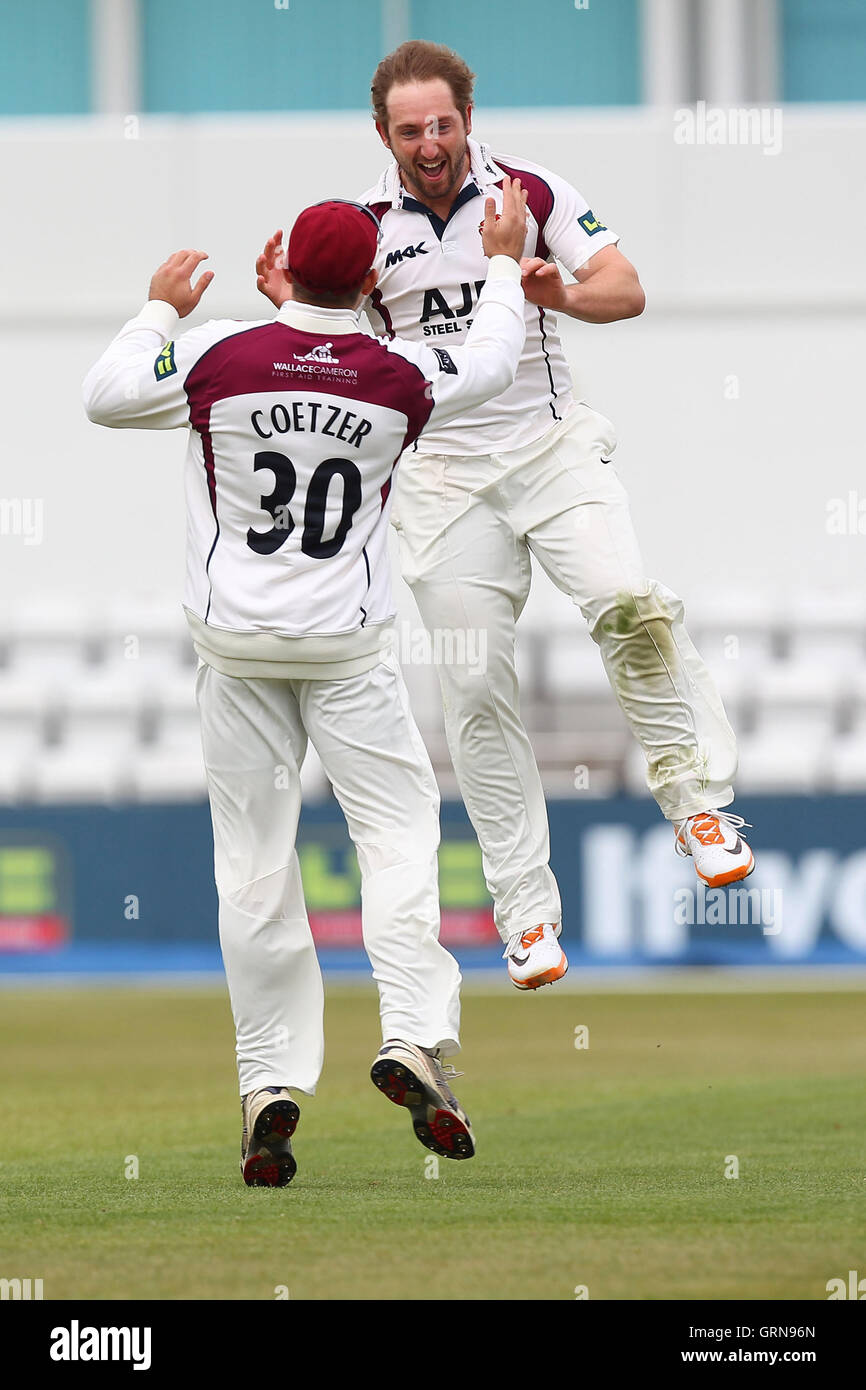 Steven Crook of Northants celebrates the wicket of Ravi Bopara with ...