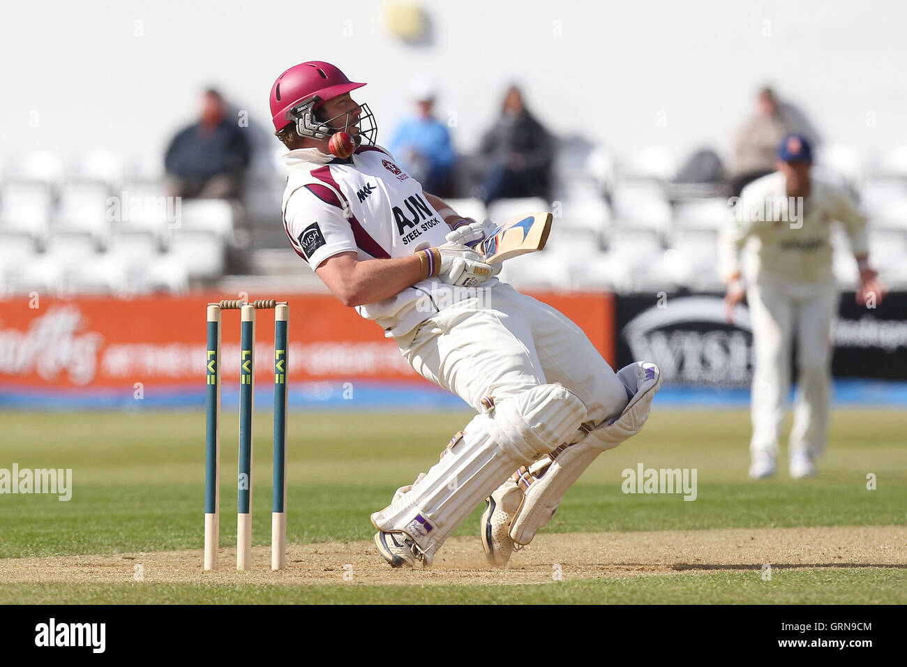 Steven Crook of Northants ducks under a Tymal Mills bouncer ...
